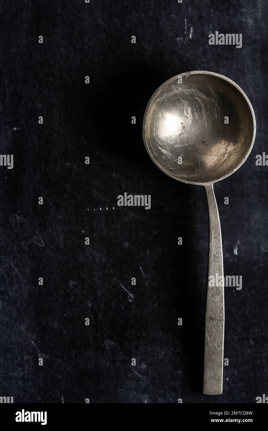 Big old empty spoon on black background. Flat lay. Top view. Food ...