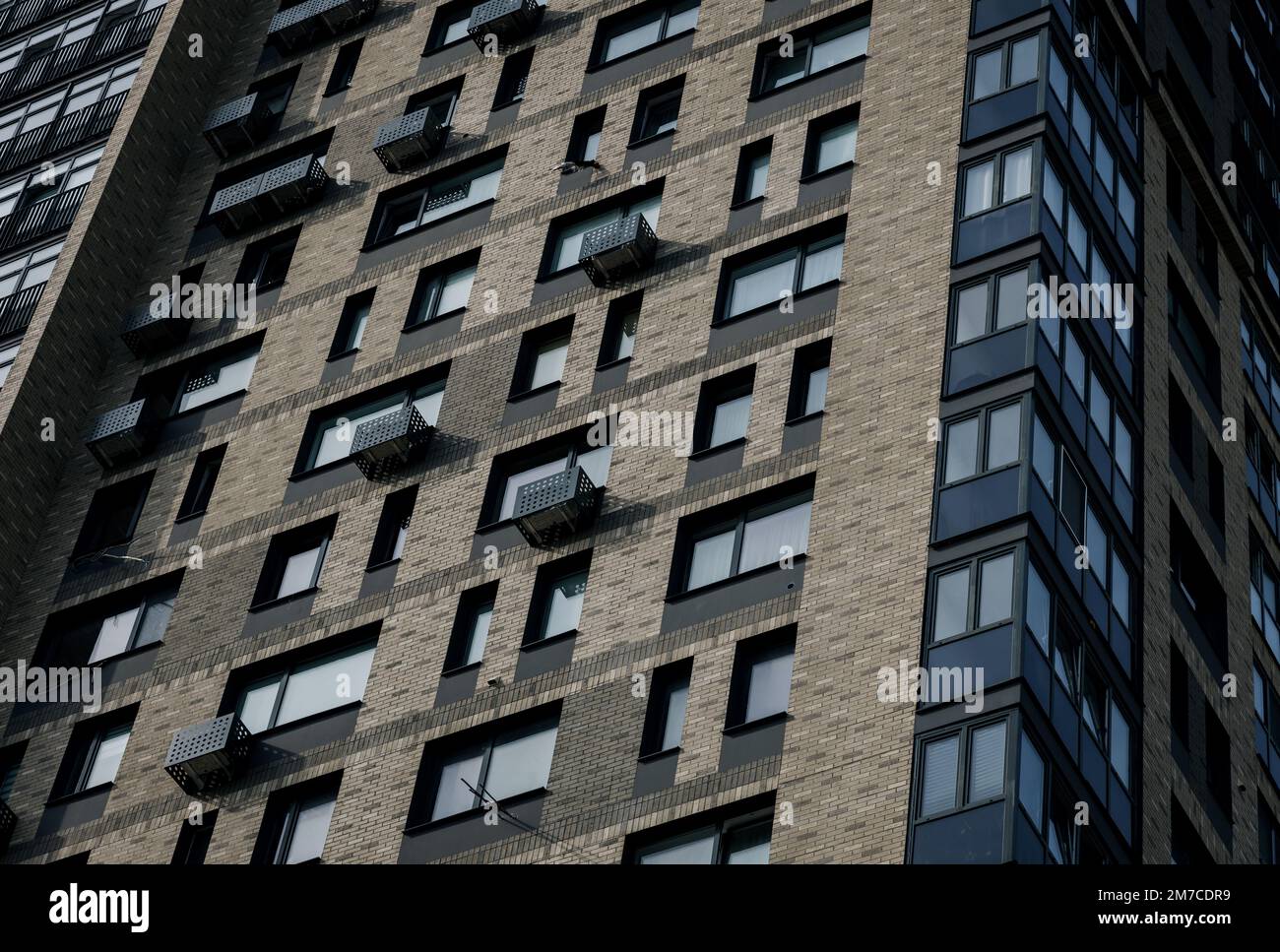 facade of a modern building. architecture of the city is made of brick ...