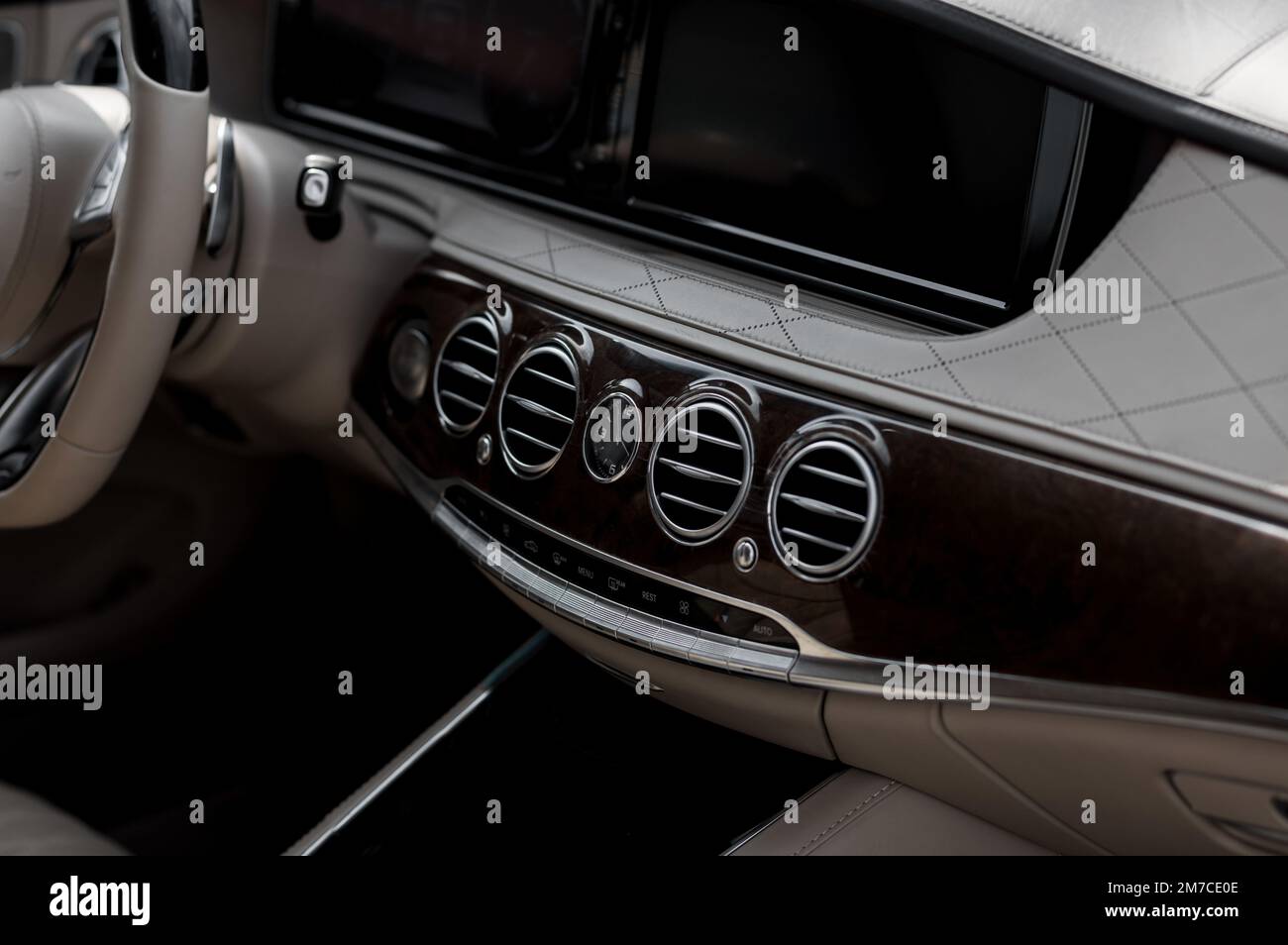 Luxury car interior. Steering wheel, watch Stock Photo - Alamy