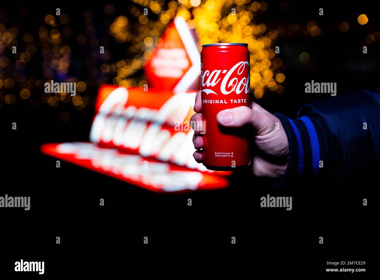Belgrade, Serbia - January 5, 2023: Coca Cola can in hand with Coca ...