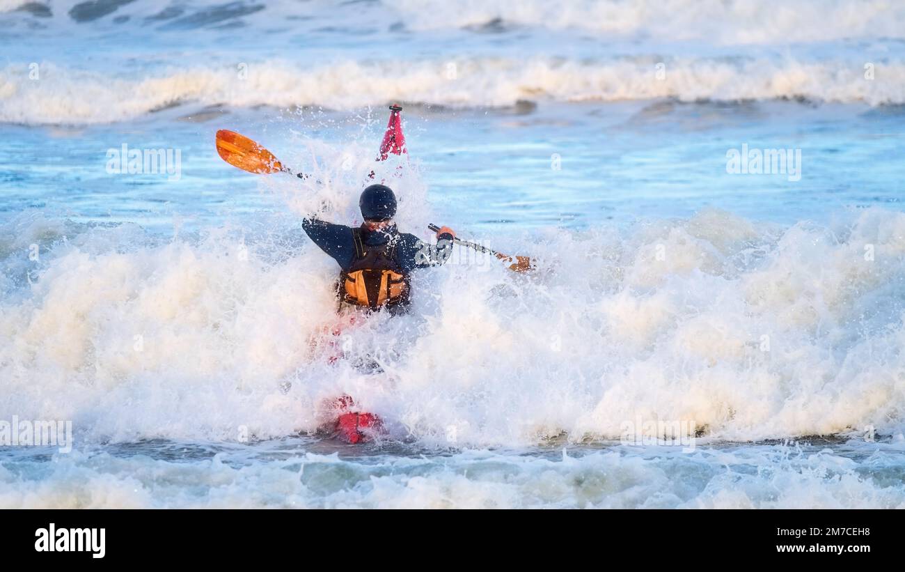 Kayaking in ocean surf Stock Photo - Alamy