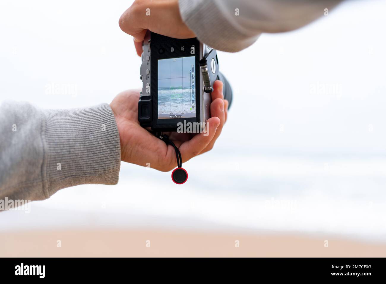 Traveller make photo using mirrorless camera in hand, travel blogger ...