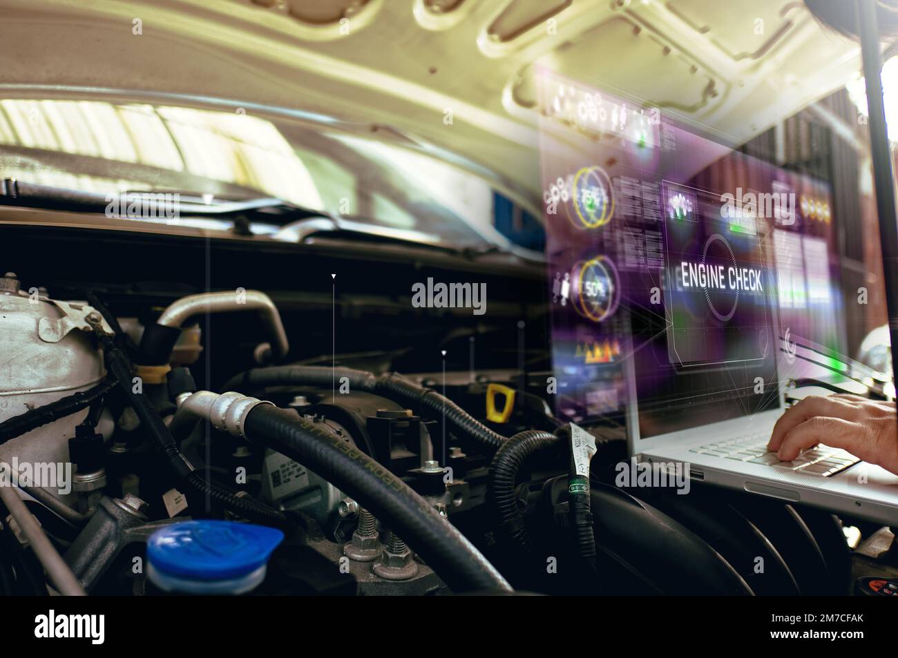 Man use laptop to analysis on his car engine with hologram. the concept ...