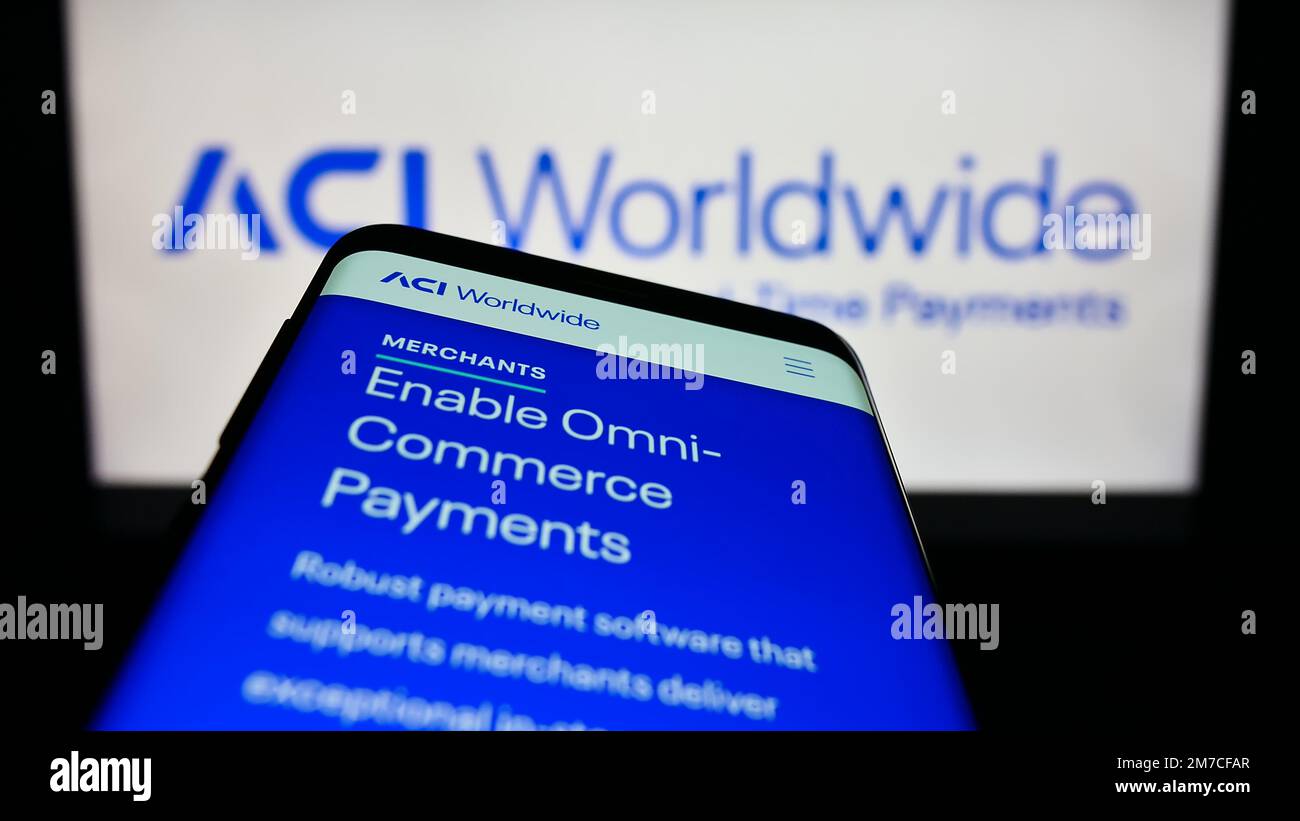 Mobile phone with webpage of US payments company ACI Worldwide Inc. on ...