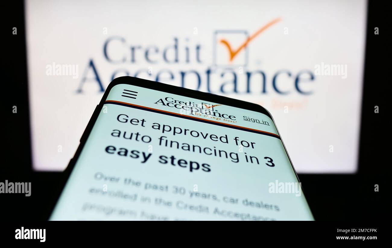Mobile phone with webpage of US auto finance company Credit Acceptance ...