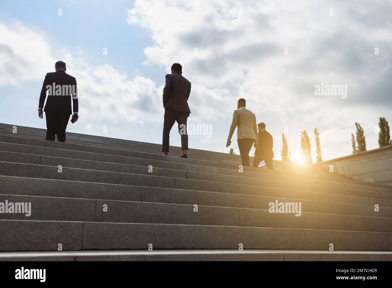 Business people climb the steps of the city stairs. impersonal rising ...