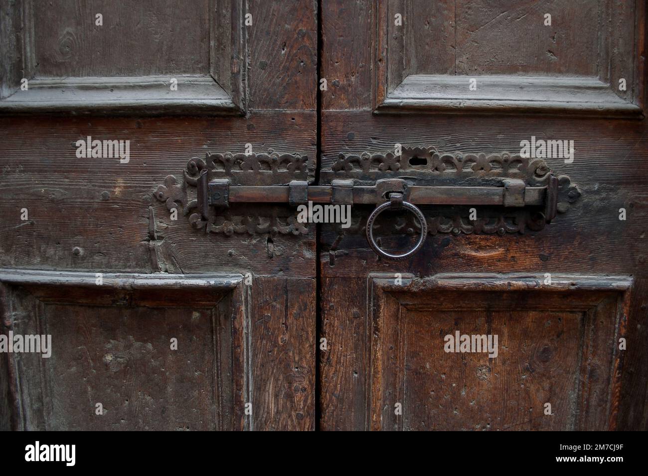 Wrought iron latch on an old door Stock Photo - Alamy