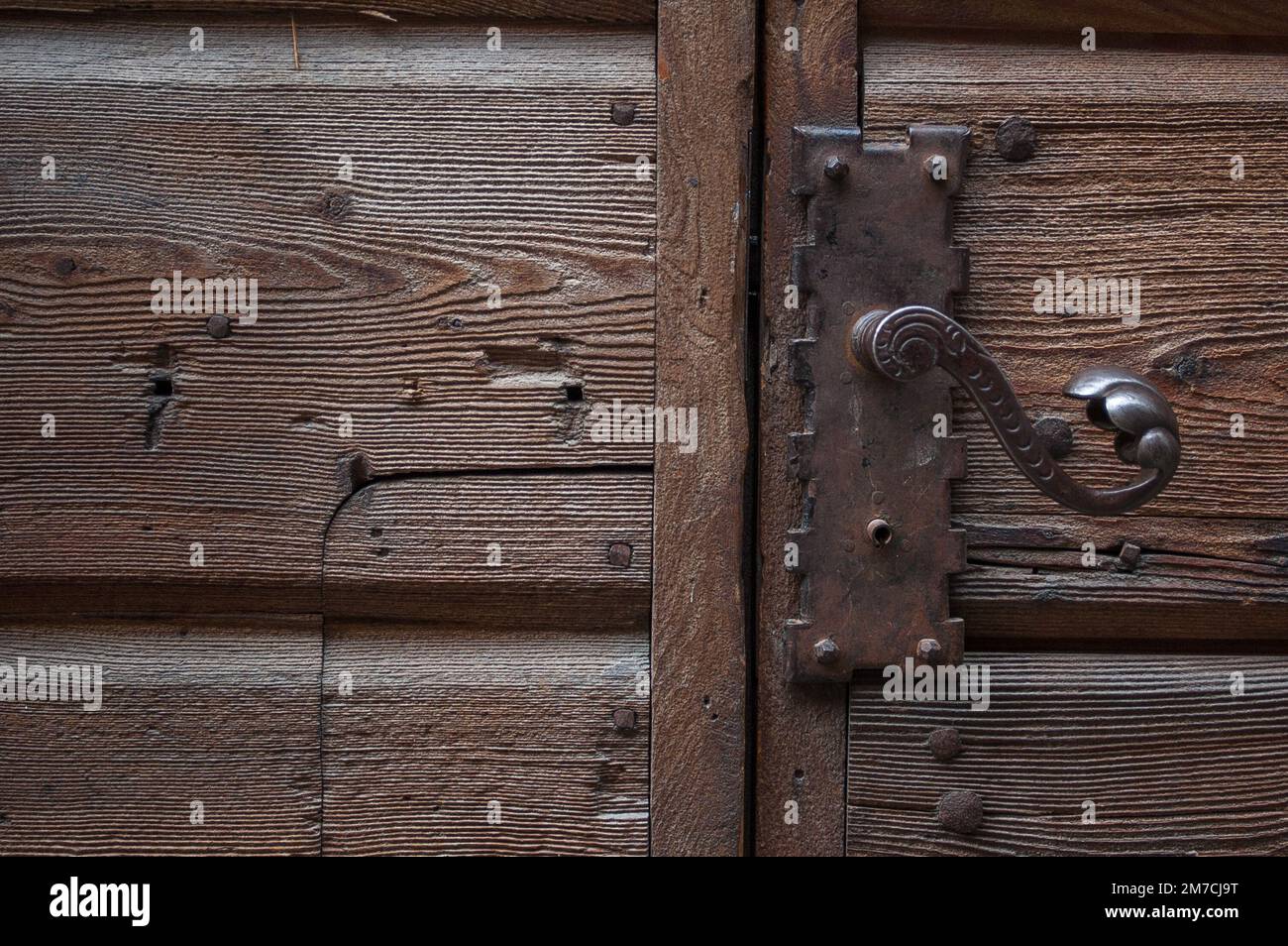 Wrought iron latch on an old door Stock Photo - Alamy
