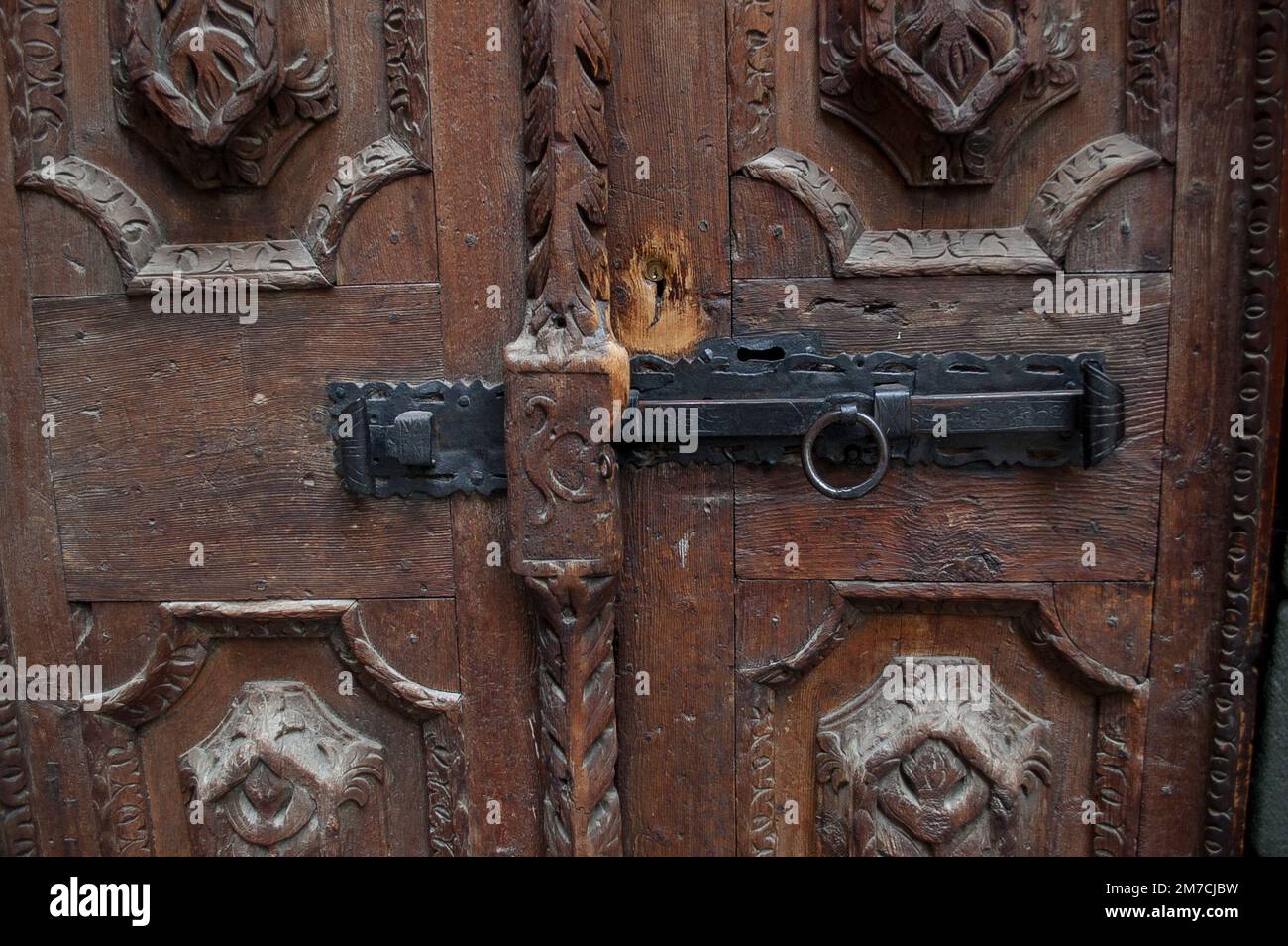 Wrought iron latch on an old door Stock Photo - Alamy