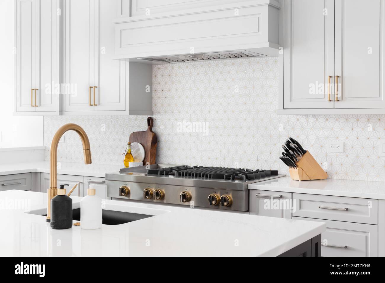 A detail shot of a beautiful kitchen's stainless steel luxury stove ...