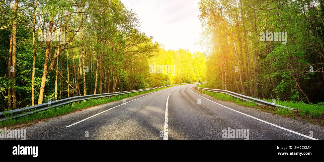 Beautiful background of the asphalt road in spring Stock Photo - Alamy