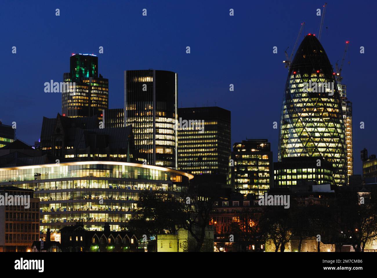 City of London buildings at twilight, London UK, including the Gherkin ...