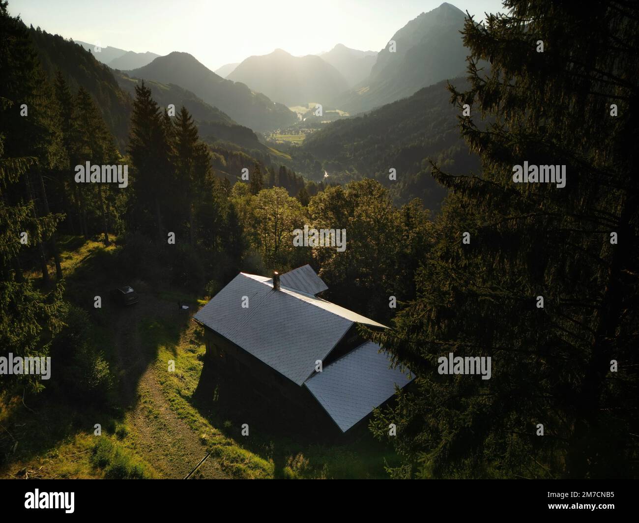 An aerial drone shot of an idyllic small house in the mountains Stock ...