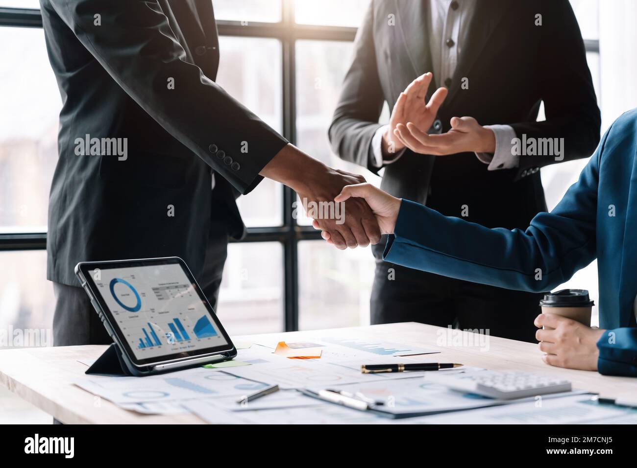 Business people shaking hands, finishing up meeting, business etiquette ...
