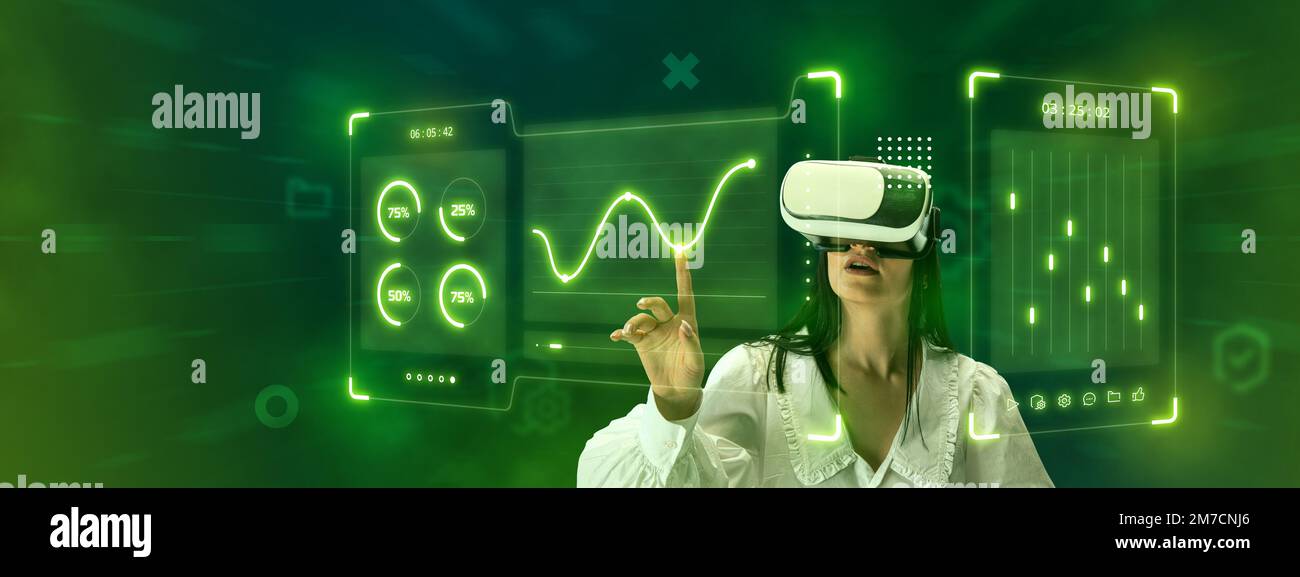 Woman, employee wearing VR glasses and working on virtual holographic ...