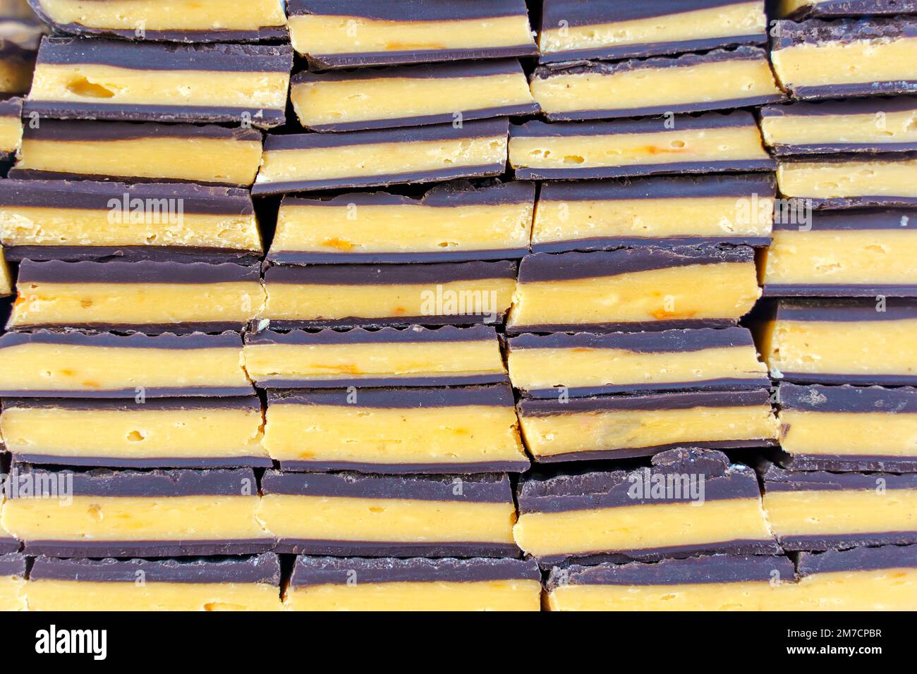 Chocolate on the showcase of a confectionery shop. Milk chocolate with ...