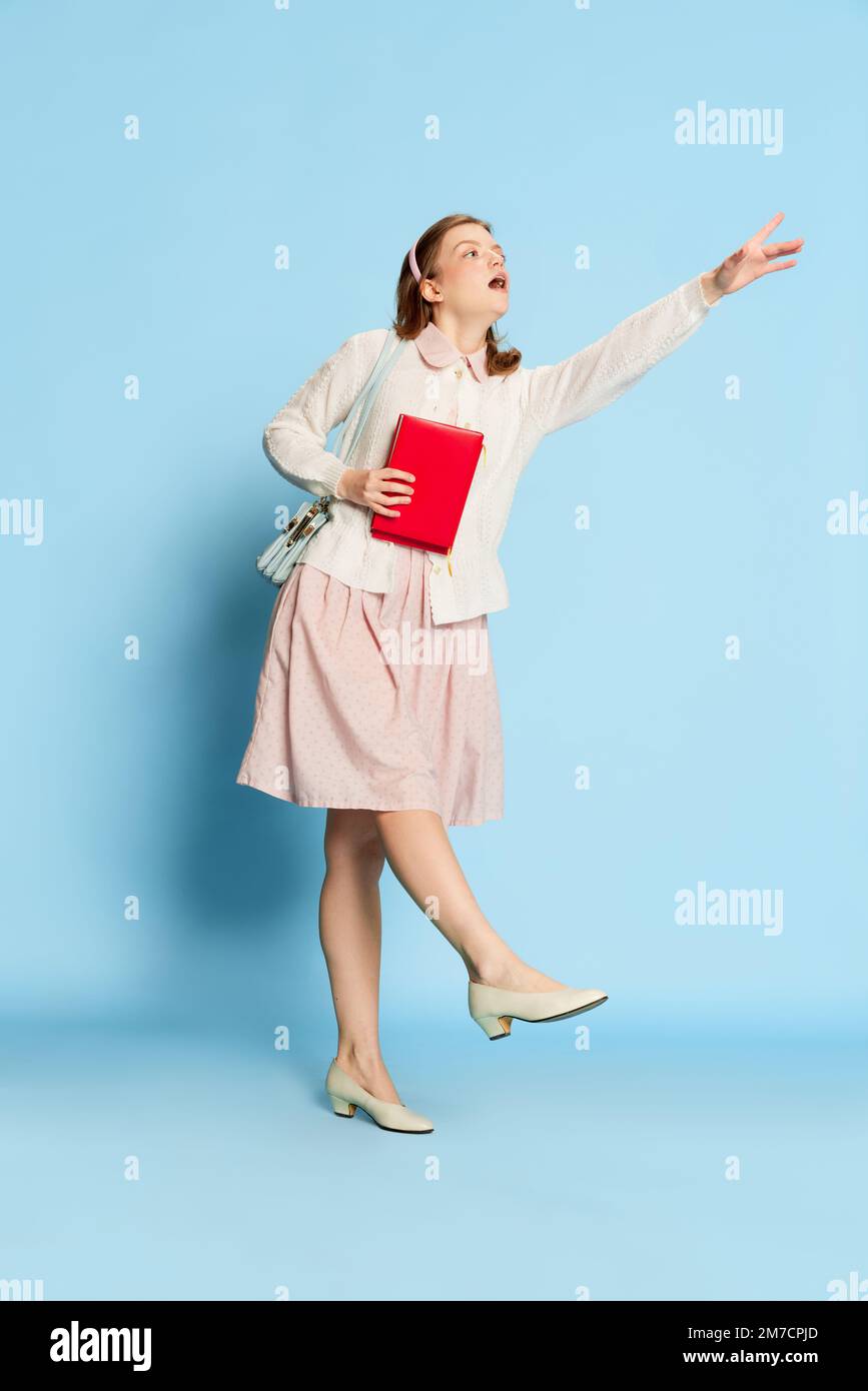 Portrait of funny beautiful girl in vintage style outfit posing over ...