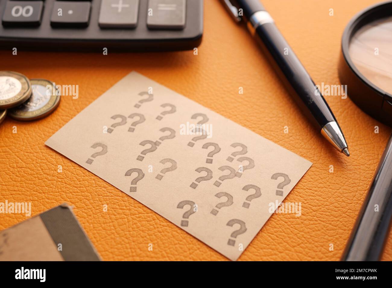 high angle view of question mark on paper on office desk Stock Photo ...