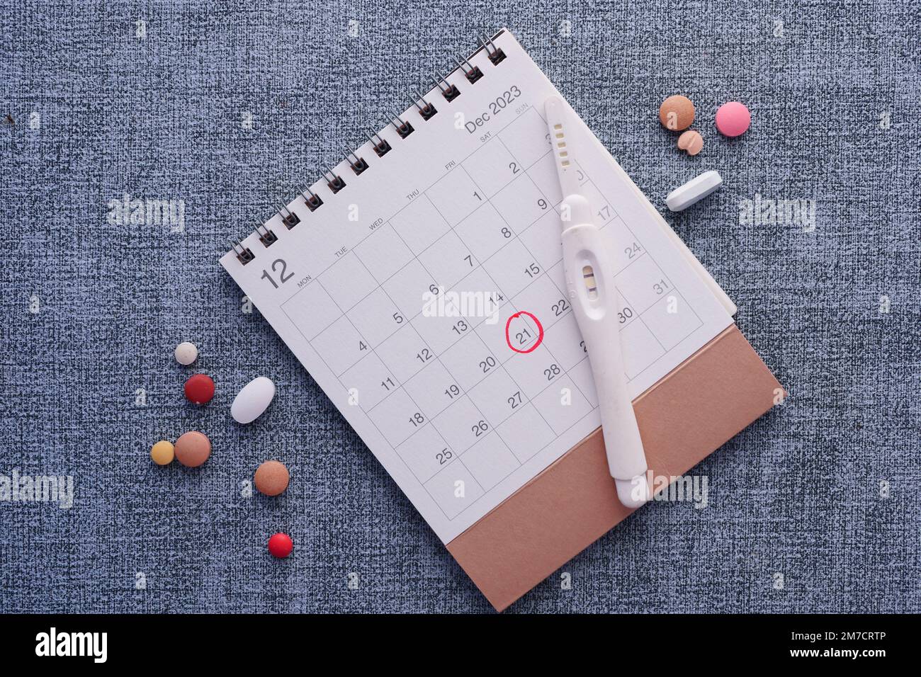 Pregnancy test kit on a calendar close up Stock Photo - Alamy