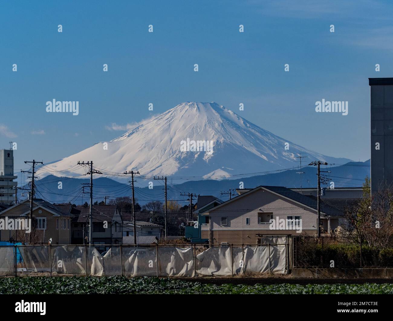 Mt. Fuji rises above the neighborhoods of Yamato city, Kanagawa ...