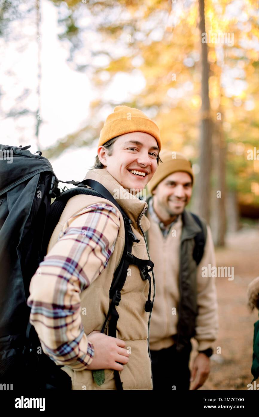 Portrait happy man backpack hi-res stock photography and images - Alamy
