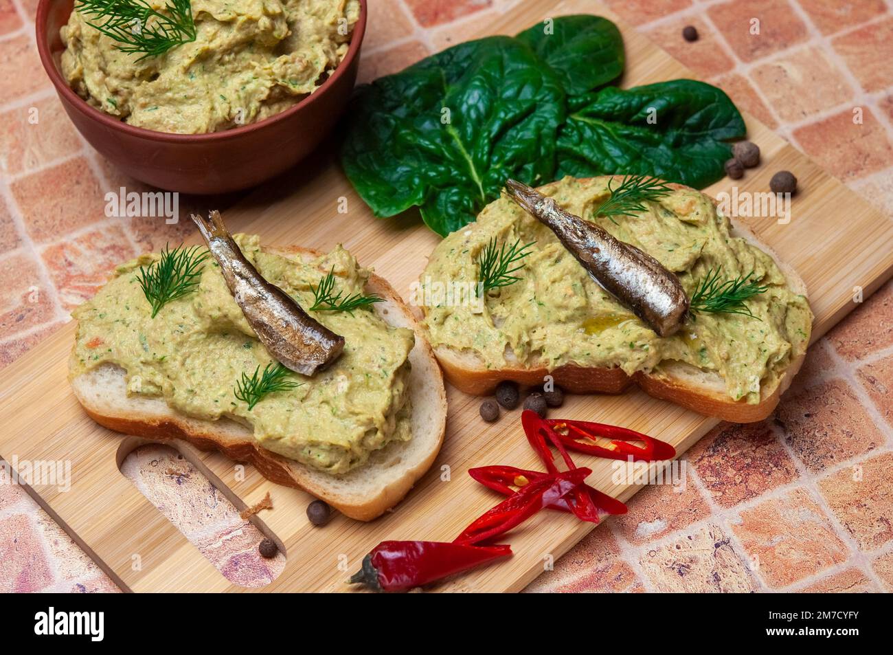 Sandwich with pate and sprats. Sprat pate with spinach and pepper ...