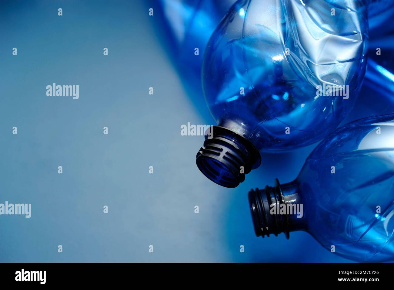 empty blue plastic bottle, recycling concept Stock Photo - Alamy
