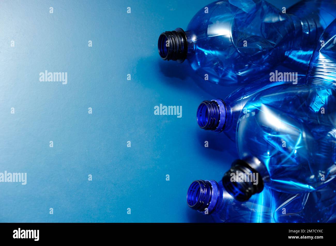 empty blue plastic bottle, recycling concept Stock Photo - Alamy