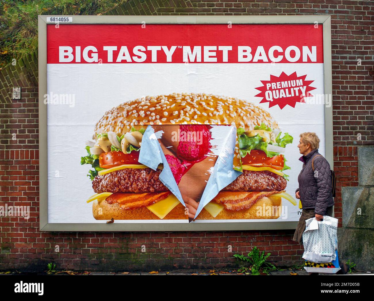 Netherlands, Arnhem Mac Donald's billboard is pasted over a lingery ...