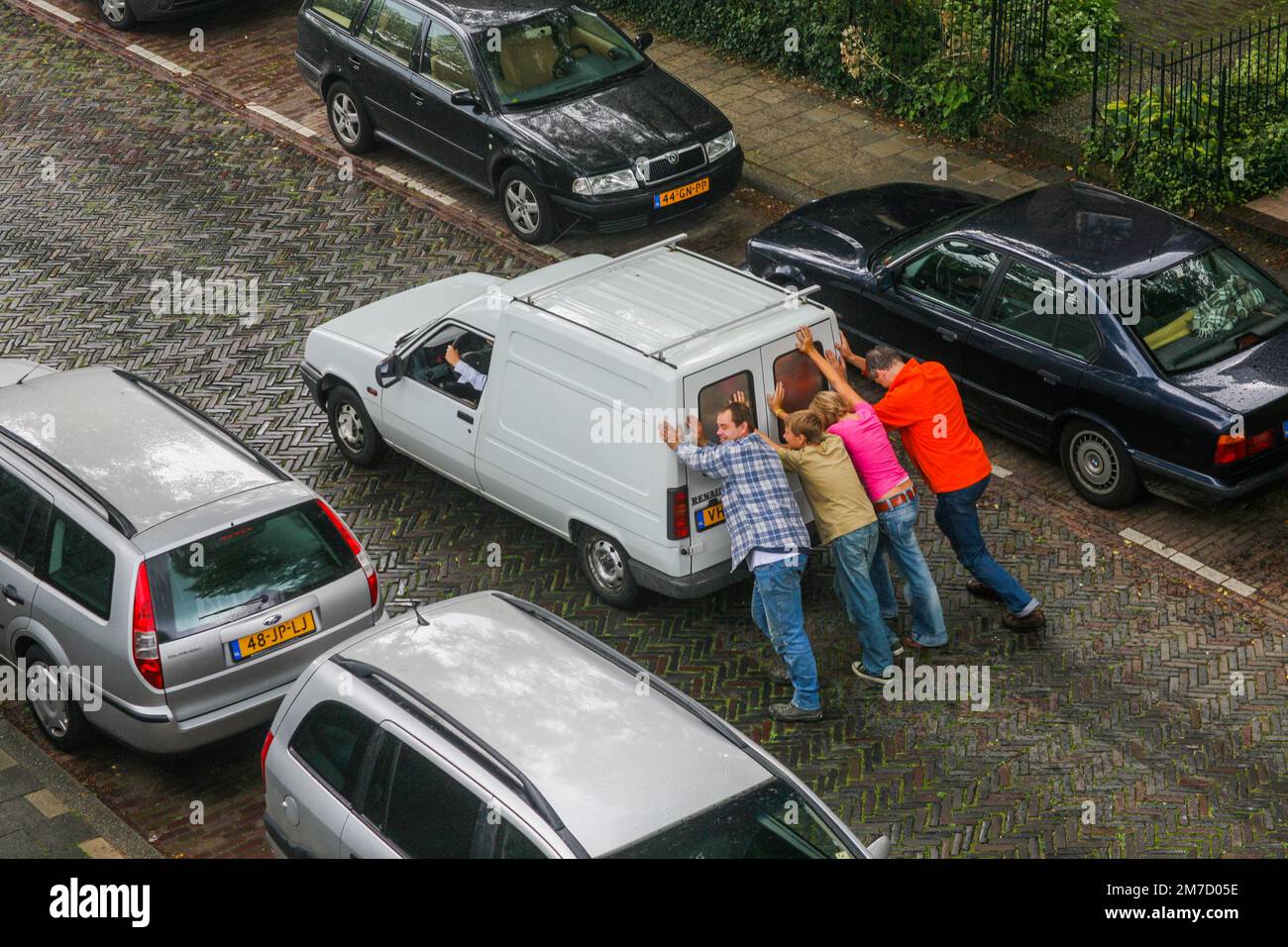 Netherlands, a broken car is pushed Stock Photo - Alamy