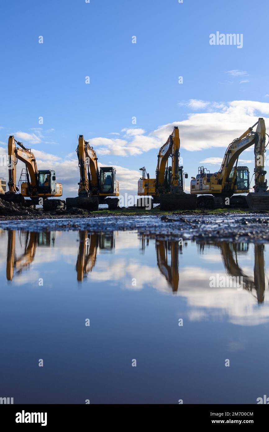 09 January 2023, Saxony-Anhalt, Magdeburg: Excavators stand side by ...