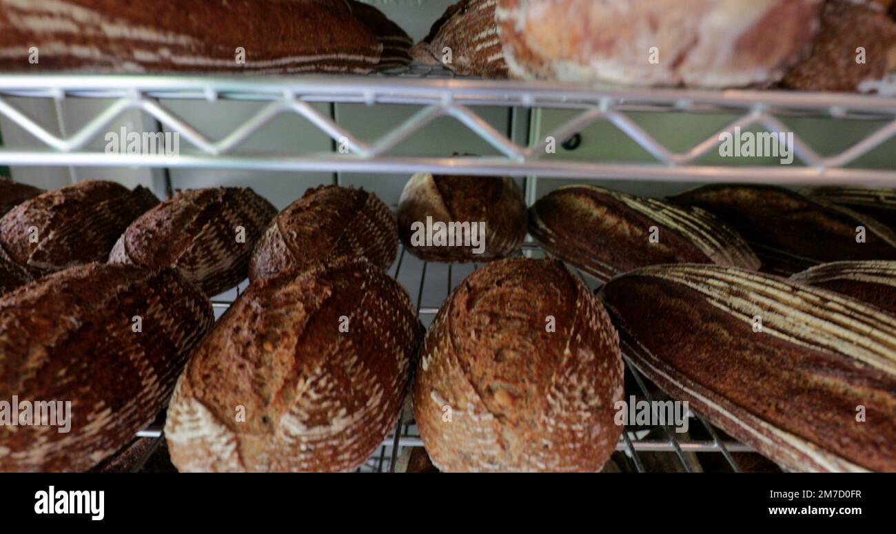 Traditional bread stacked on shelves Stock Photo - Alamy