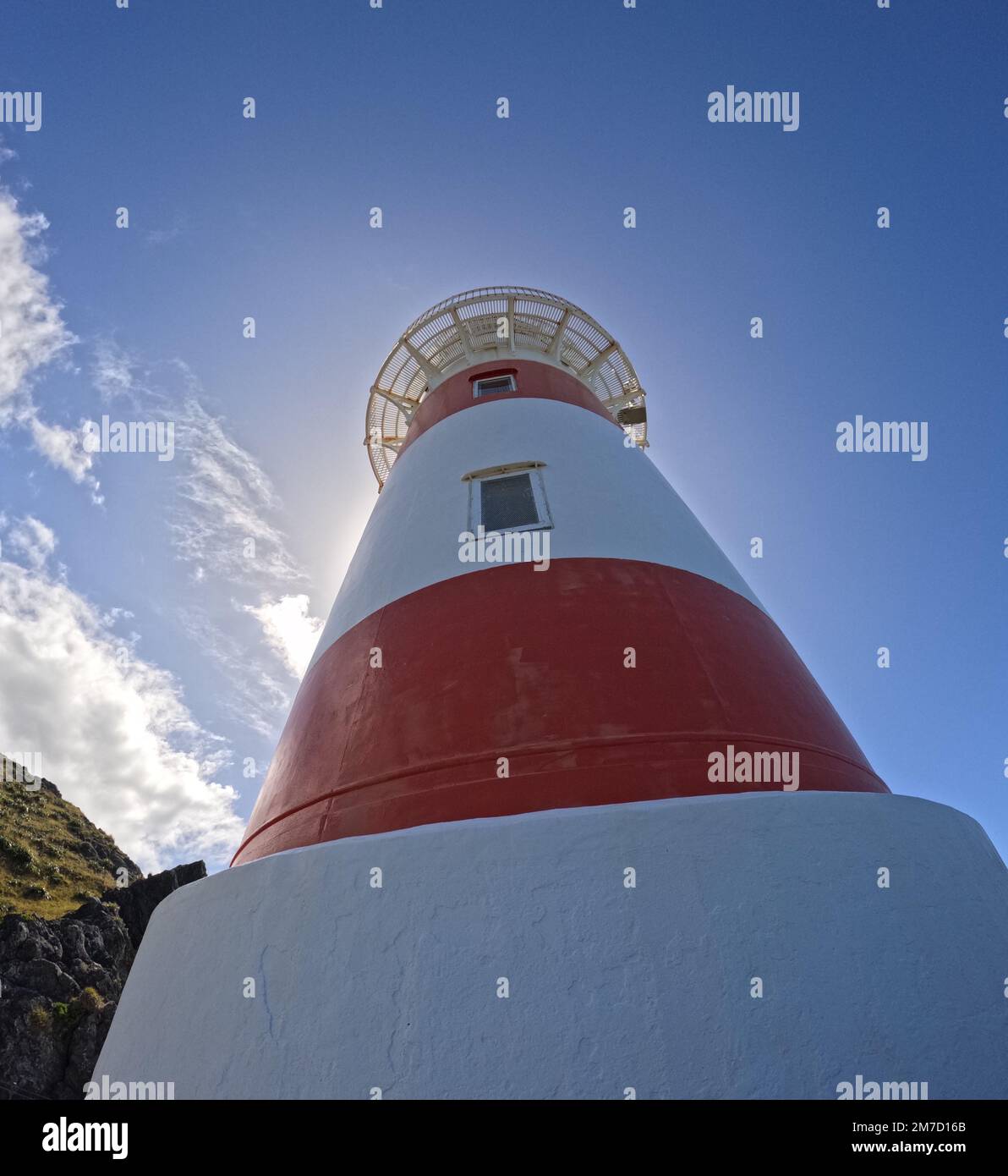 A vertical low-angle shot of a lighthouse against the background of the ...