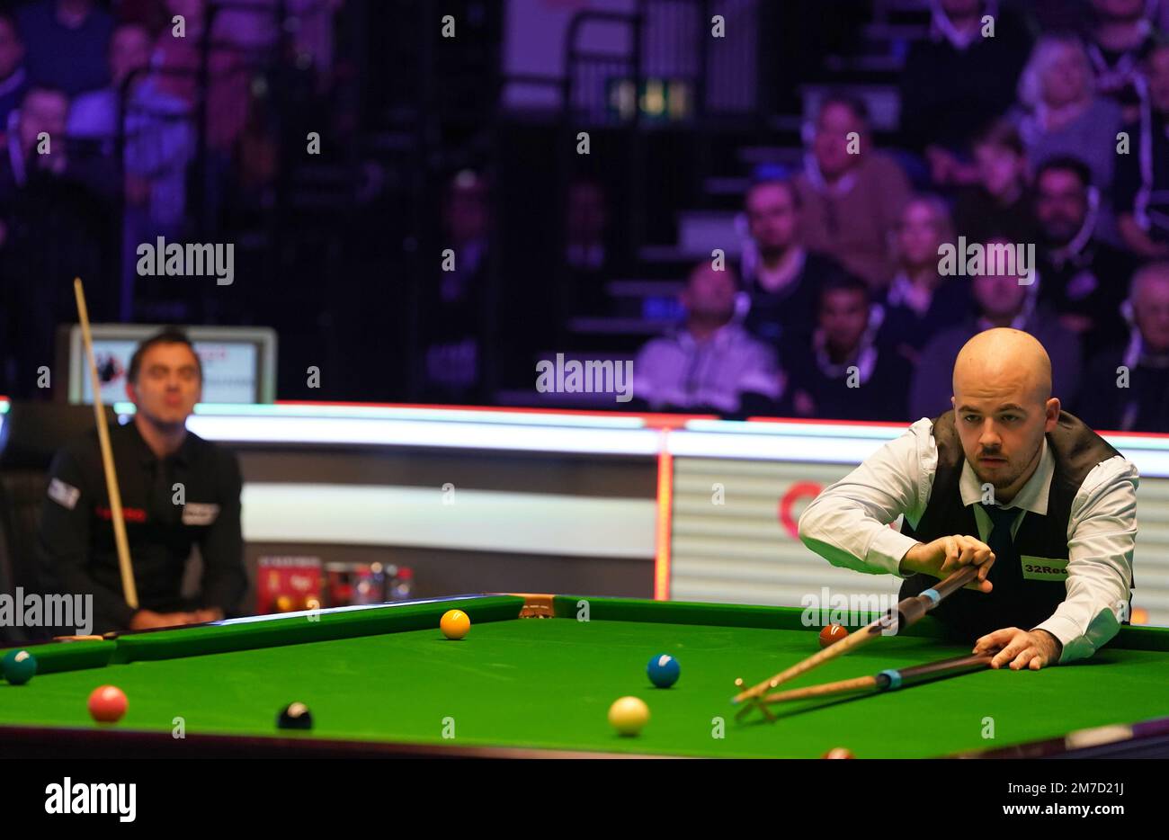 Luca Brecel in action against Ronnie O'Sullivan during day two of the ...