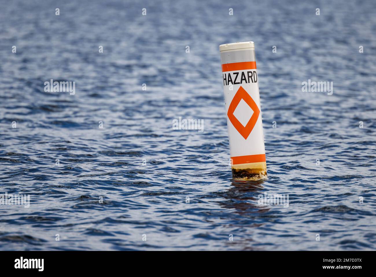 Hazard safety buoy alerting boaters to navigation danger. Nautical ...