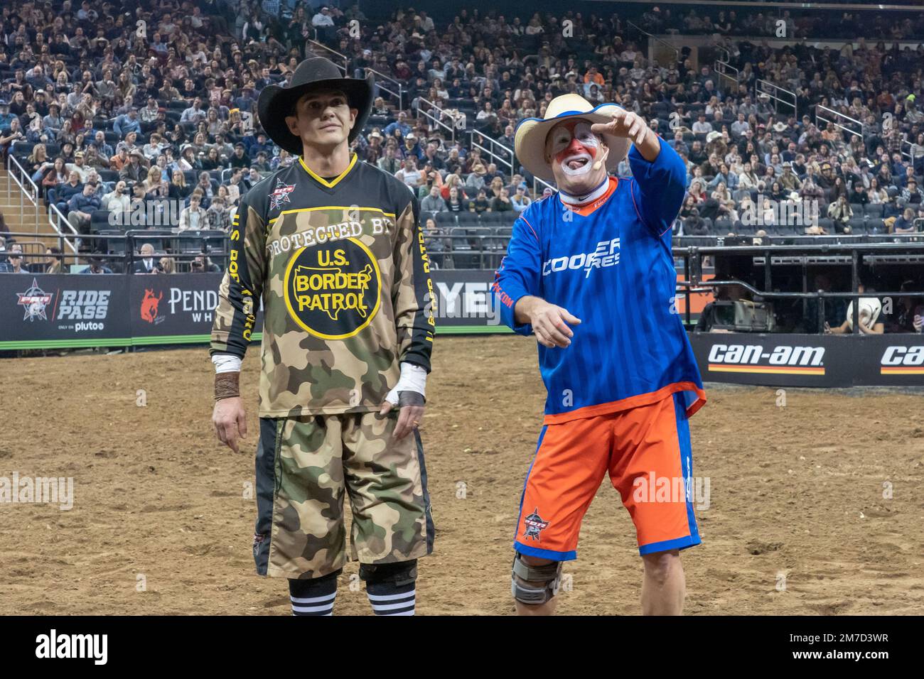 PBR barrelmans Lucas Teodoro and Flint Rasmussen look out at the crowd ...