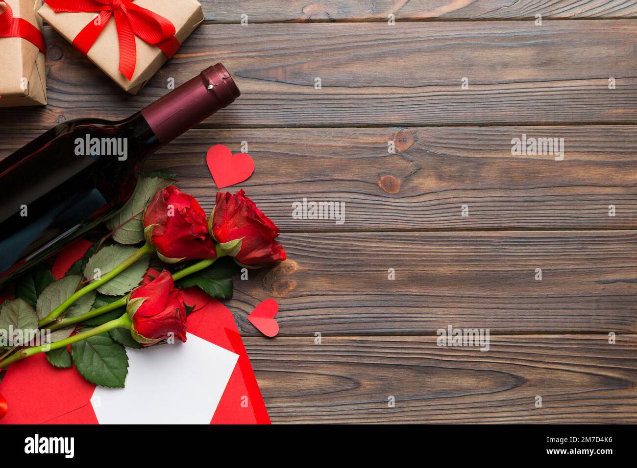 Valentine's day composition with red wine, rose flower and gift box on ...
