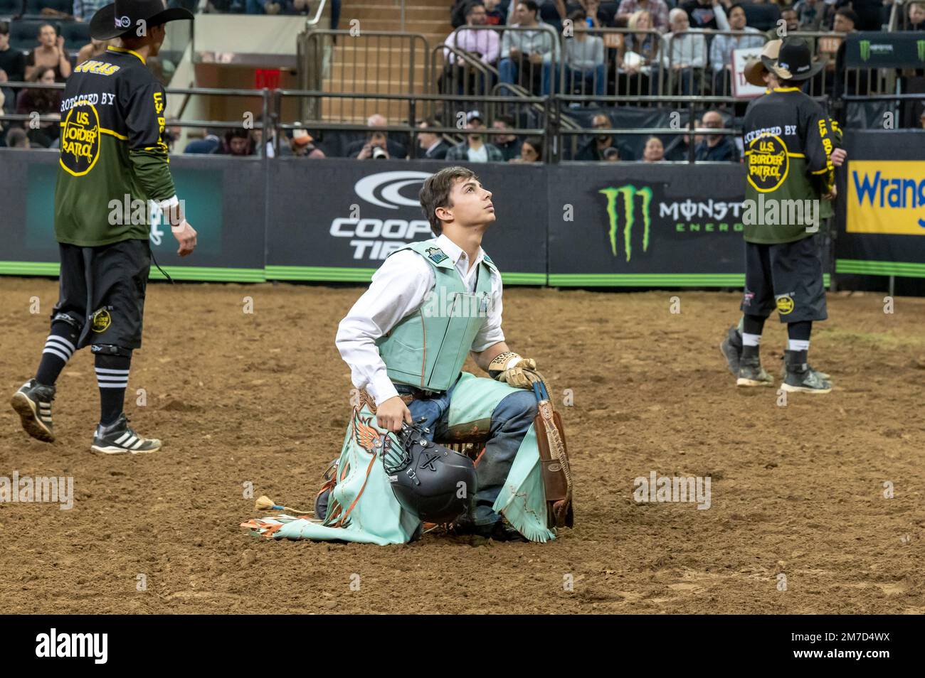 Thiago Salgado walks after riding Cousin Eddy during the second round of the Professional Bull ...