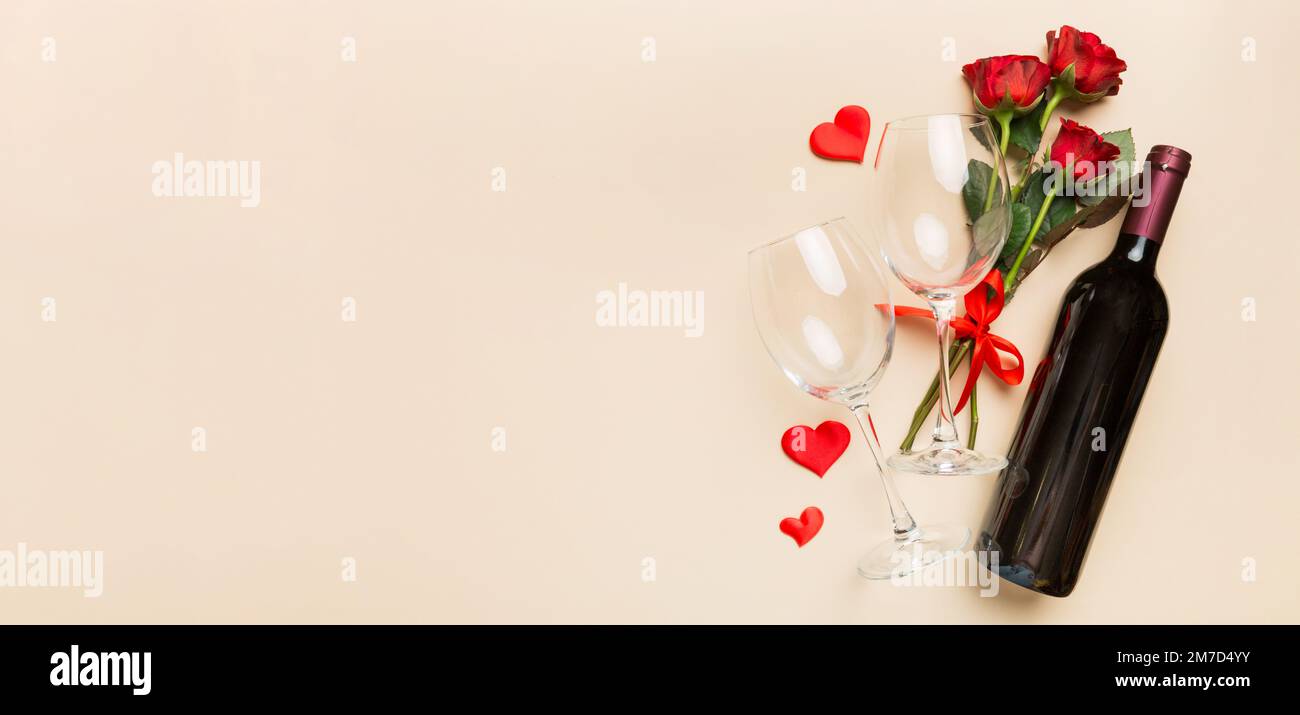 Valentine's day composition with red wine, rose flower and gift box on ...
