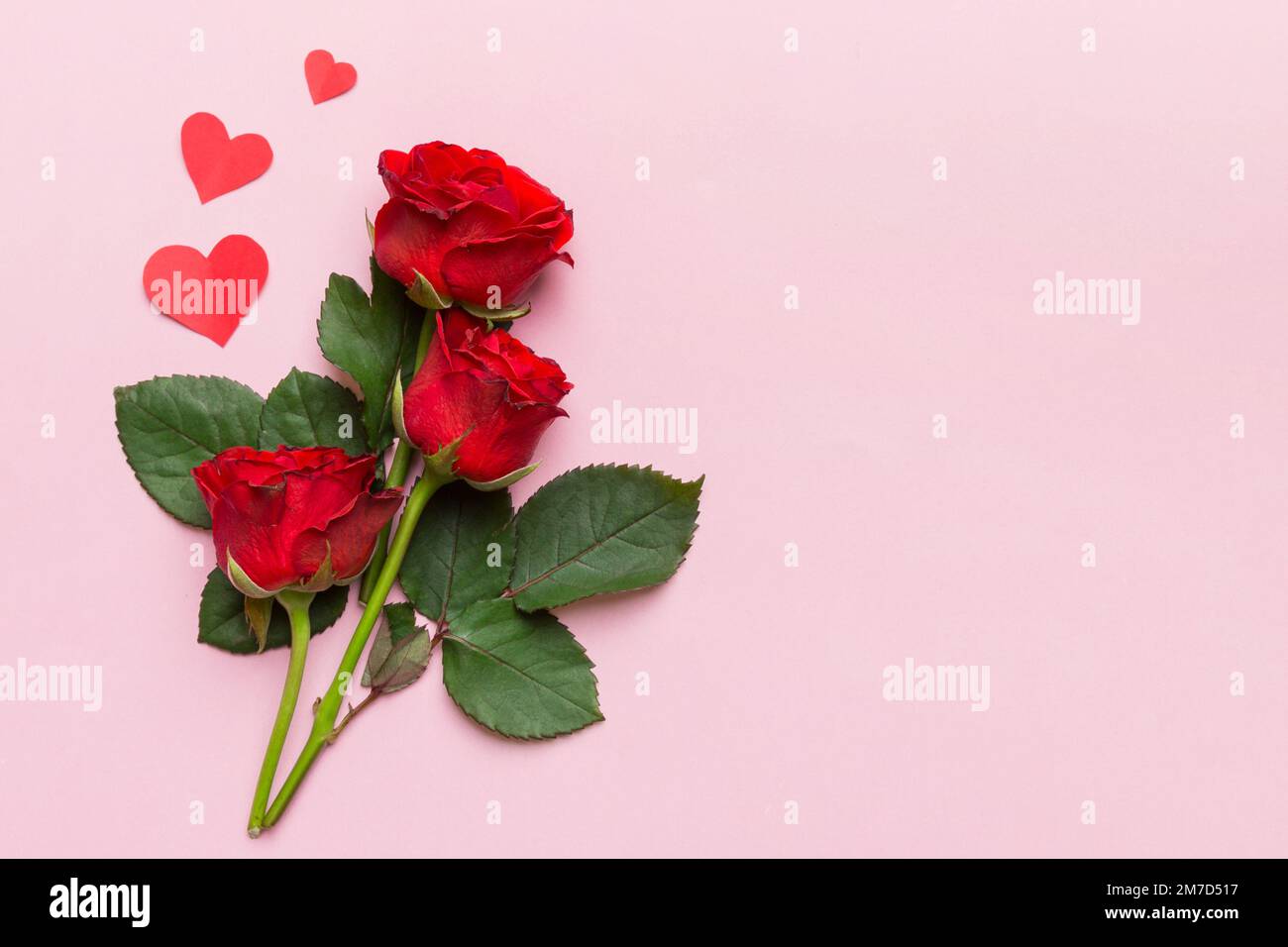 Valentine day composition with rose flower and red heart on table. Top ...