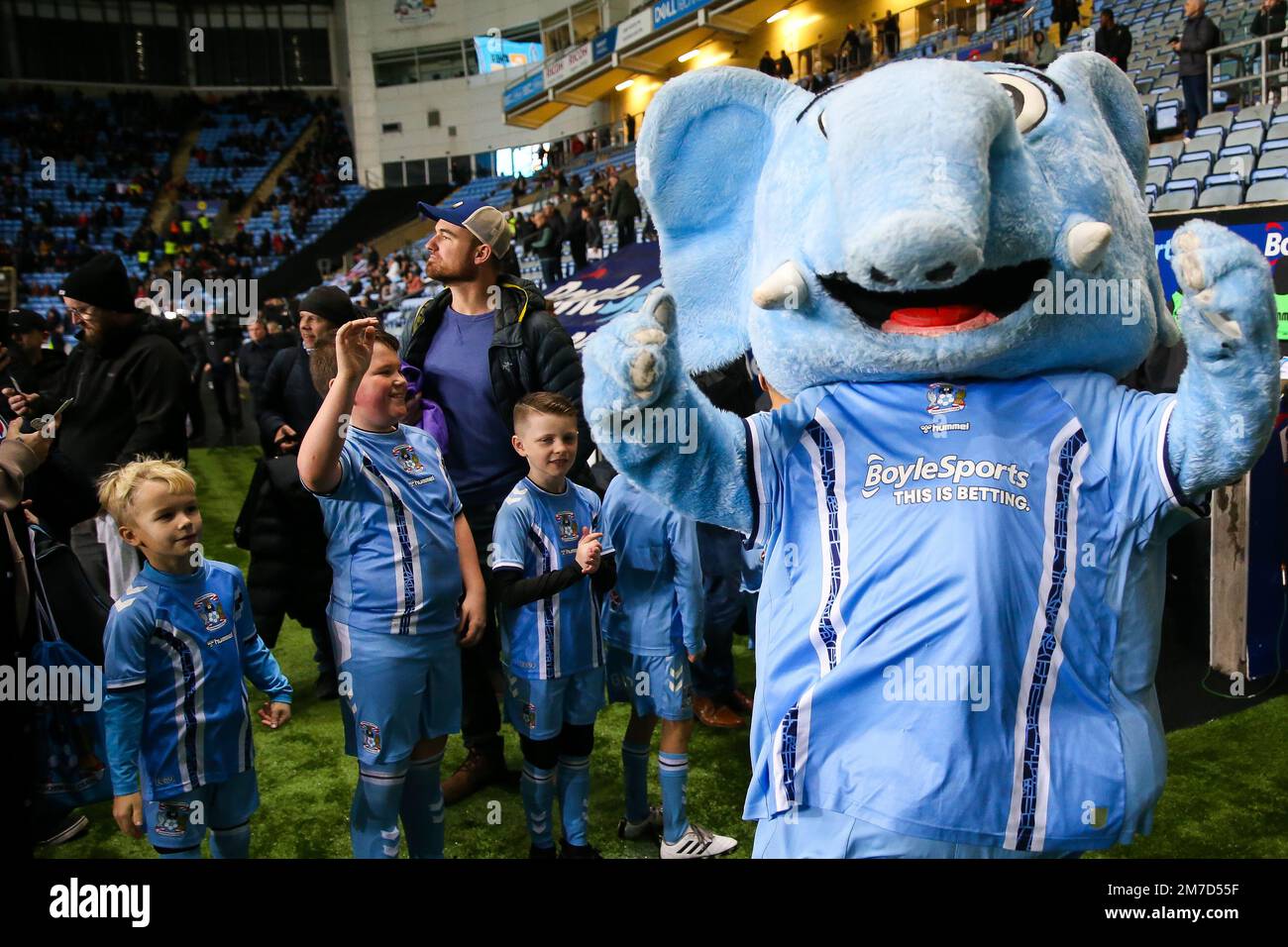 Coventry City mascot Sky Blue Sam poses for a photo with young match ...