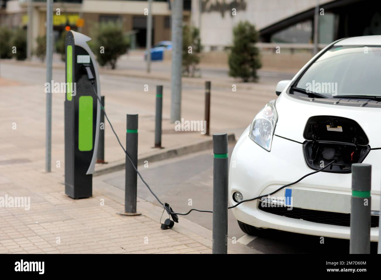 Charging modern electric cars, new energy vehicles, NEV, on the street ...