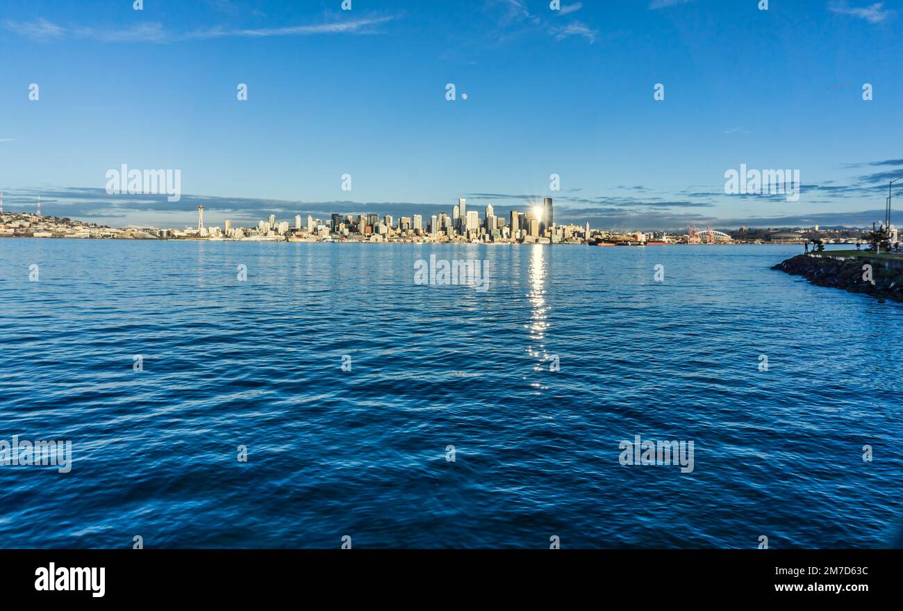 The sun reflects from buildings in the skyline of Seattle, Washington ...