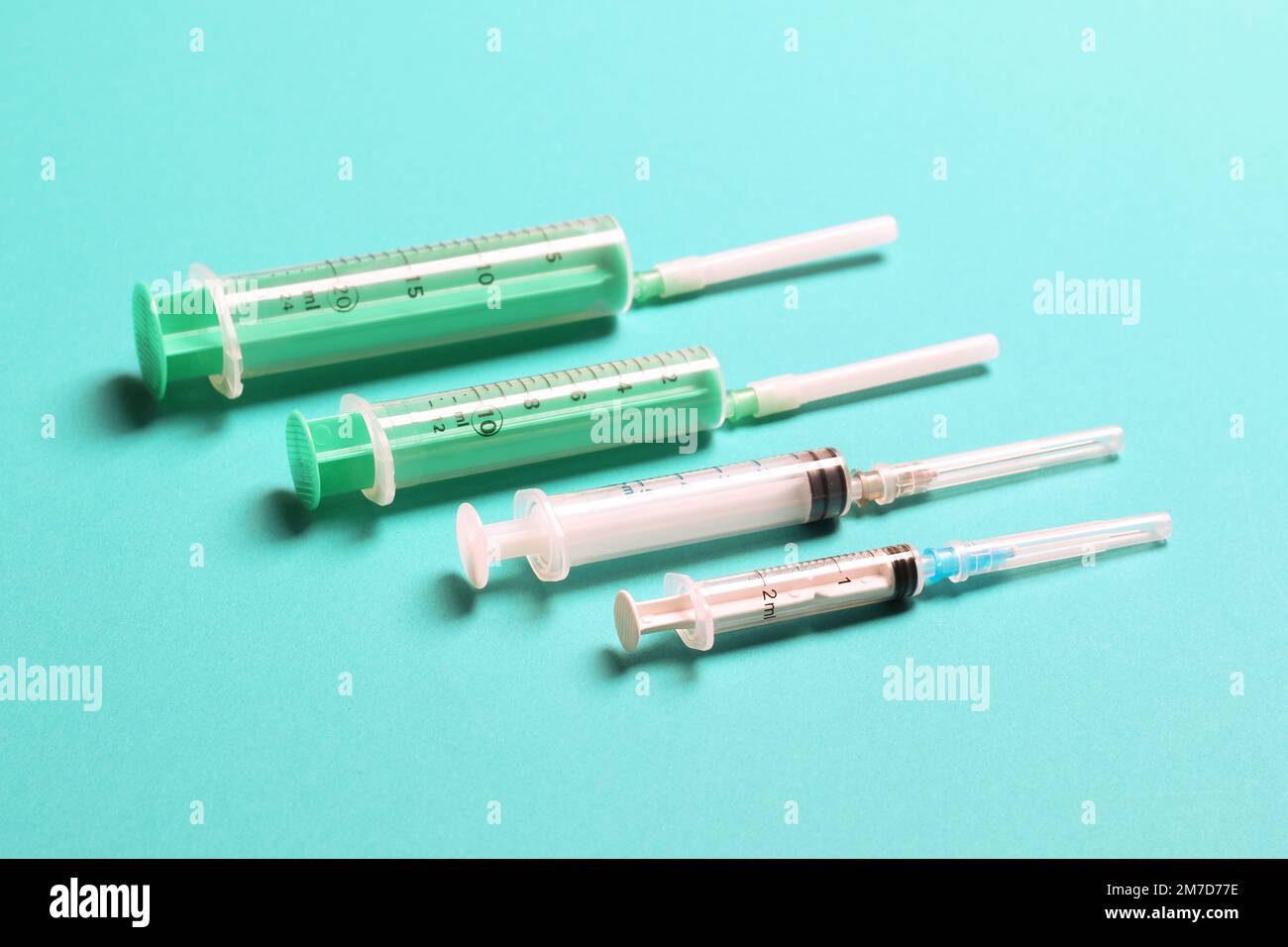 Top view of different syringes for injection on colorful background ...