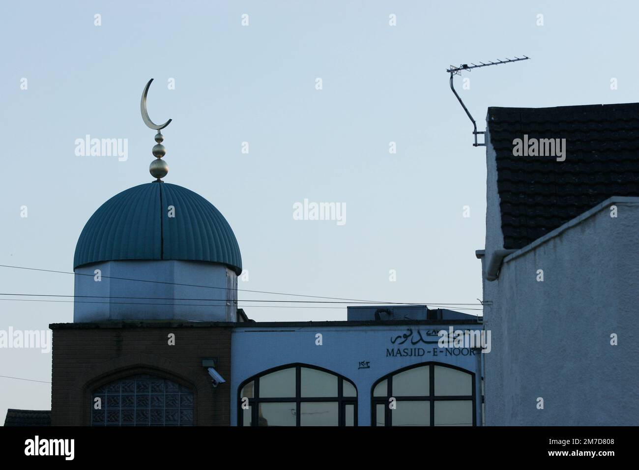 The Sickle moon or crescent adornes the top of a mosque in the Uk as ...