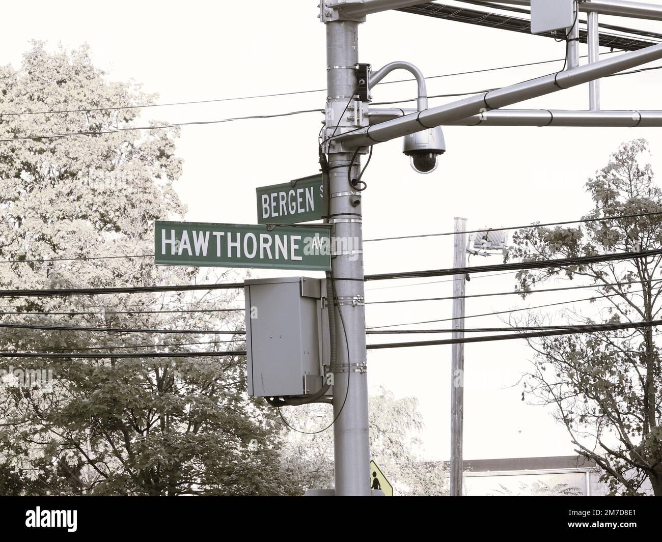 A street sign and road camera on the post Stock Photo - Alamy