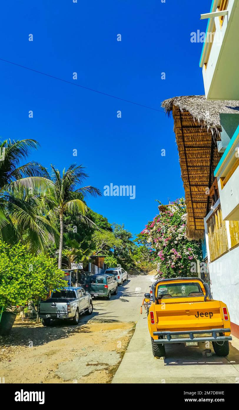 Colorful streets cars high traffic stores people buildings and trade in ...