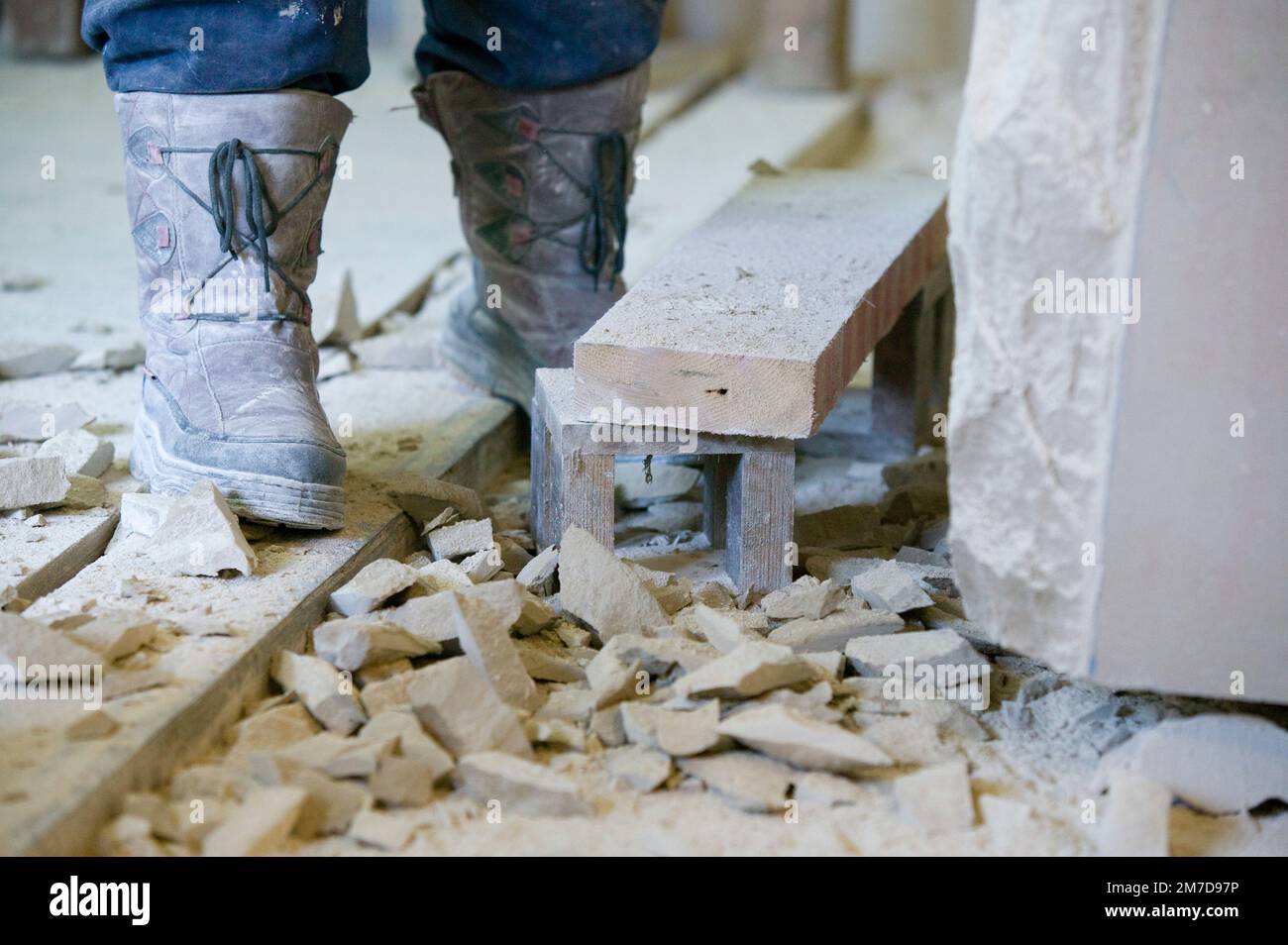 Sculptures or work persons tools covered in dust on a work bench Stock ...