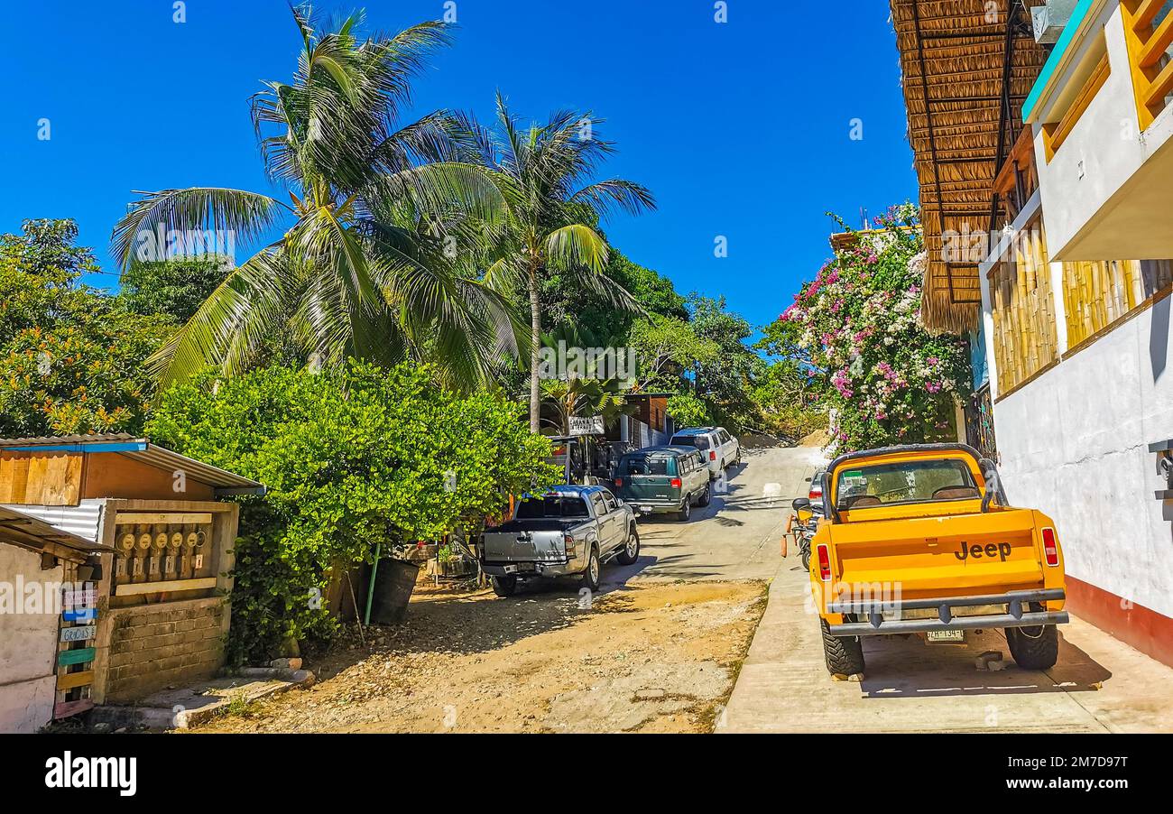 Colorful streets cars high traffic stores people buildings and trade in ...