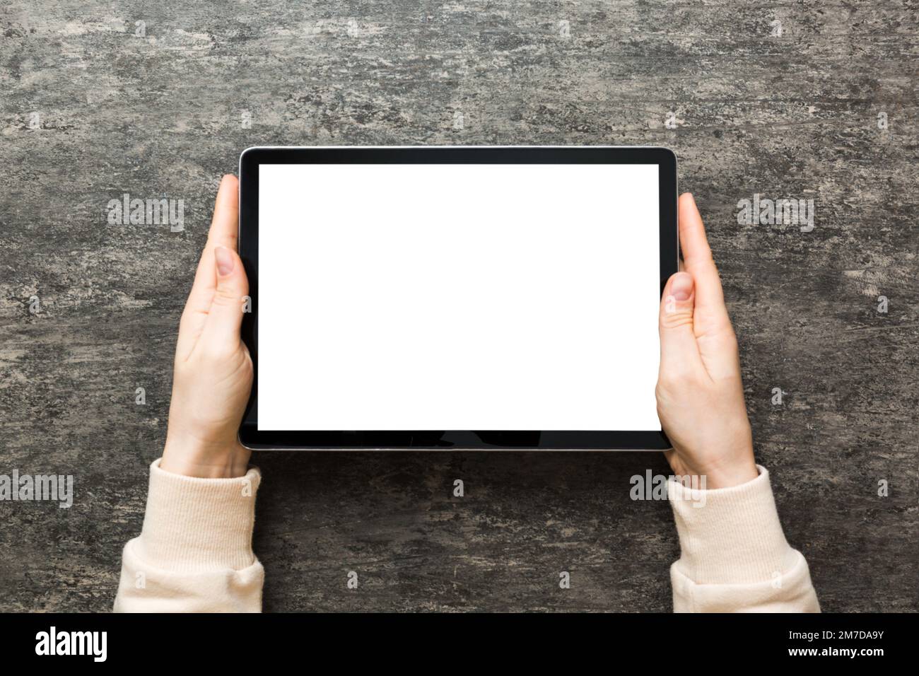 female teen hands using tablet pc with white screen, Mockup image of ...
